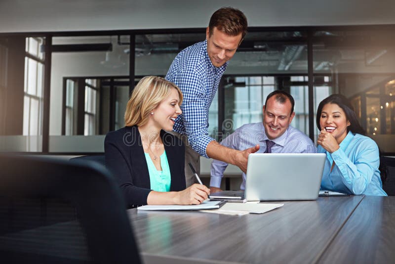 Exploring Different Options As a Team. a Group of Colleagues Using a ...