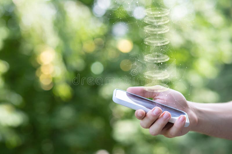 Exploring Digital Technology with a Smartphone in a Green Stock Image ...