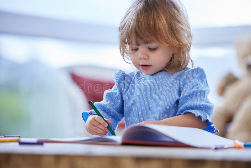Exploring Her Creative Side. a Little Girl Drawing at Home. Stock Image ...