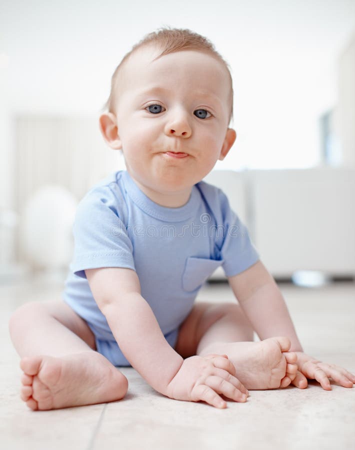 Exploring the Living Room. a Baby Boy Sitting on the Living Room Floor ...