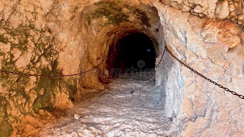 Exploring a Mysterious Cave Tunnel with Intriguing Rock Formations ...