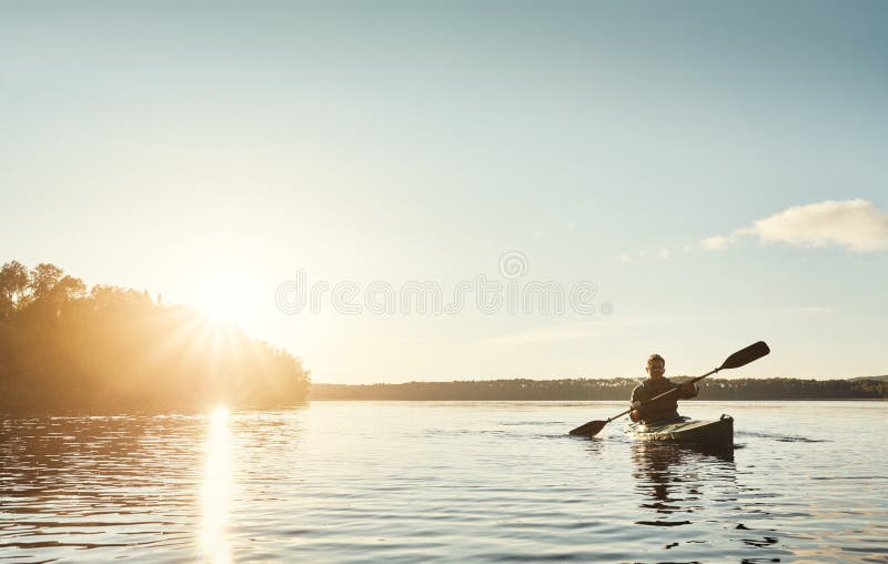Exploring the Outdoors One Paddle at a Time. a Young Man Kayaking on a ...