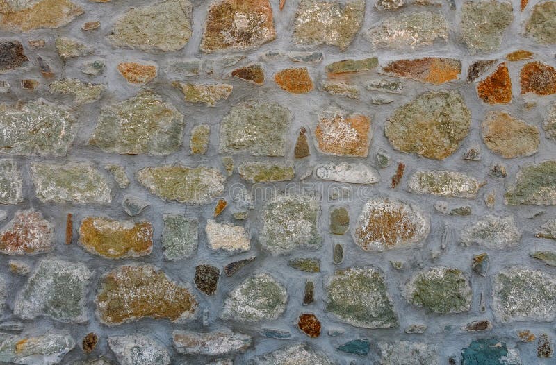 Exploring Textures and Colors of an Ancient Stone Wall in a Quaint ...