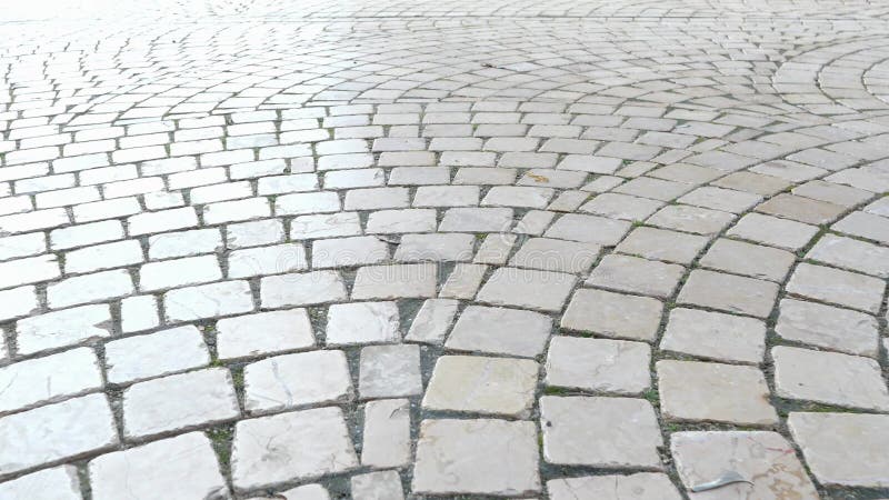 Exploring the Unique Cobblestone Patterns in a Lively City Square Stock ...