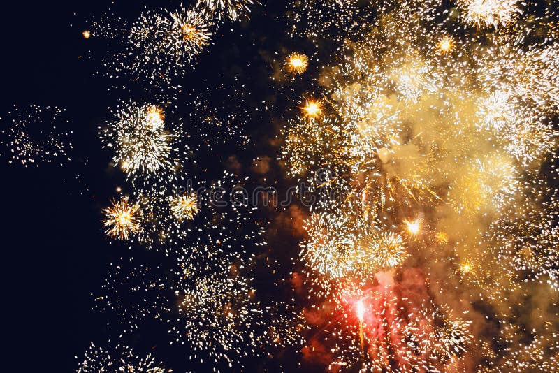 Exploding Golden Bright Fireworks Against a Night Sky Stock Photo ...
