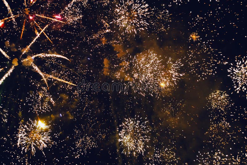 Exploding Golden Bright Fireworks Against a Night Sky Stock Image ...