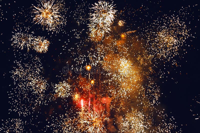 Exploding Golden Bright Fireworks Against a Night Sky Stock Image ...