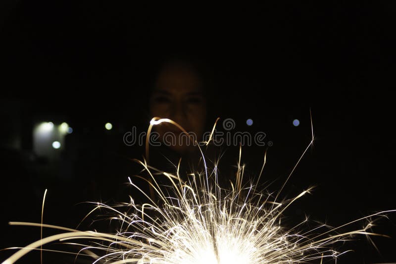 Explosion of Light Firework Flare Light Illuminates the Face of a ...