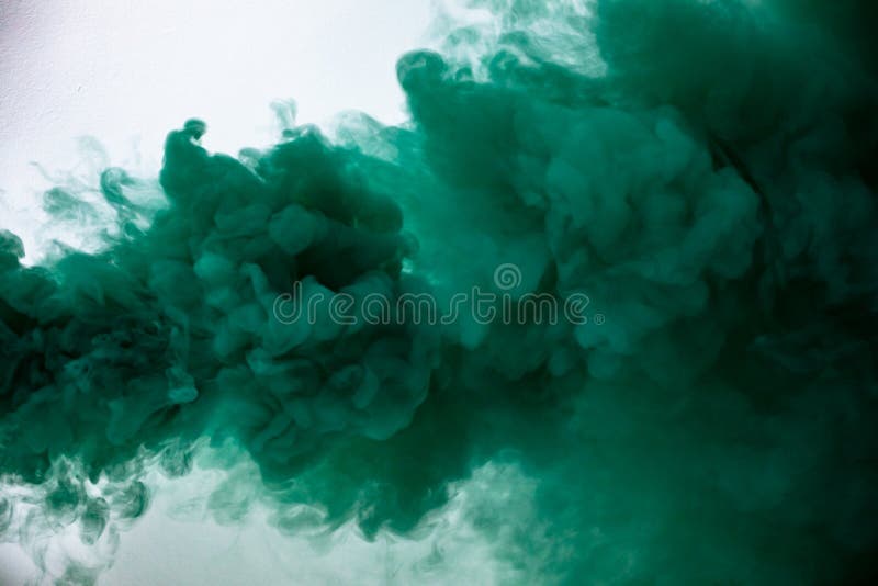 Green Smoke Bomb Exploding Against White Background Stock Photo - Image ...