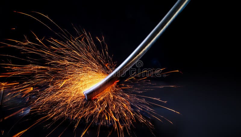 Explosive Sparks Flying from Striking Metal Tool Against Black ...