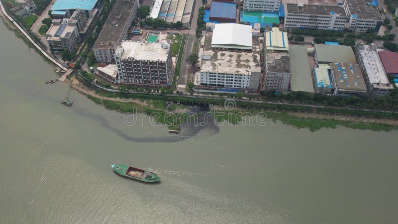 The Export Processing Zone (EPZ) of Dhaka, Bangladesh, with Boat Sailing in the Polluted River ...