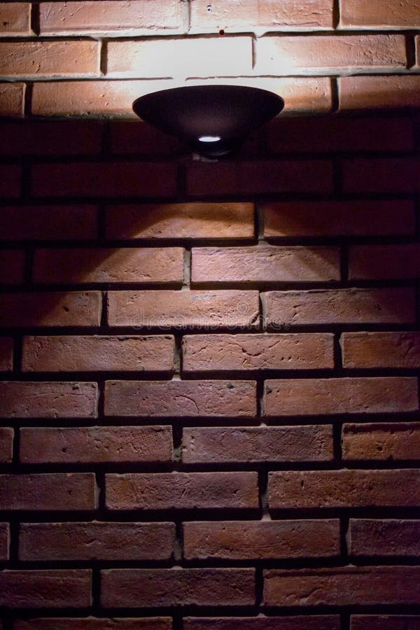 Exposed Brick Wall Illuminated by a Two-way Fixture Stock Image - Image ...