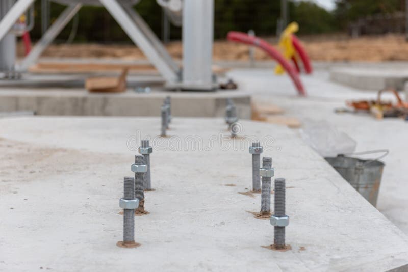 Exposed Foundation Bolts in a Concrete Base at a Construction Site ...