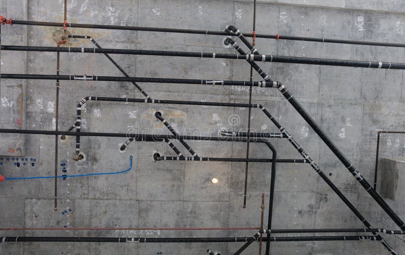 Exposed Pipes on the Building Ceiling during Construction Stock Photo ...