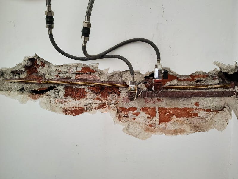 Exposed Section of a Wall Undergoing Plumbing Work Stock Photo - Image ...