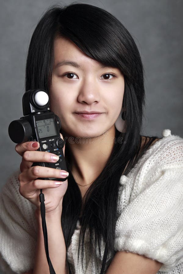 Exposure Metering with the Girls. Stock Image - Image of hand, light ...