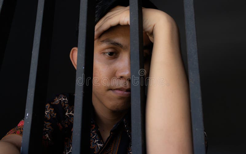Expression of Man Holding Bars in Prison Stock Image - Image of caught ...