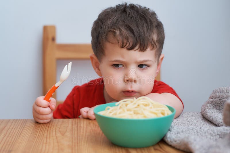 Expressive Boy is Playing with His Food at Lunch Stock Image - Image of ...
