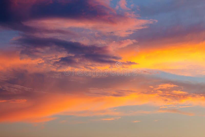 The Expressive Contrast of the Clouds in the Sky. Sunset with Bright ...