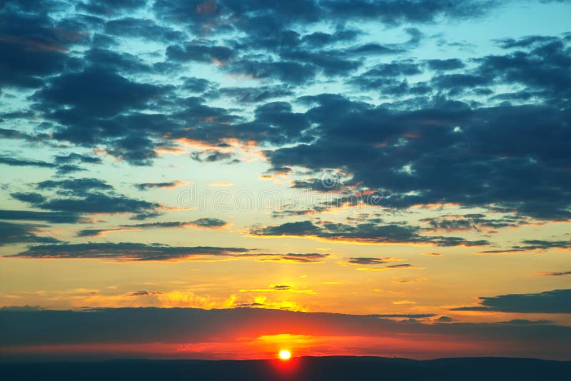 The Expressive Contrast of the Clouds in the Sky. Sunset with Bright ...