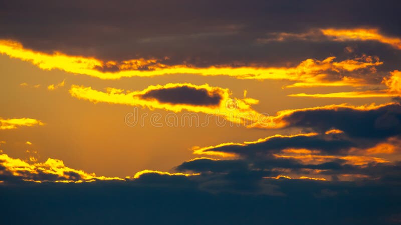The Expressive Contrast of the Clouds in the Sky. Sunset with Bright ...
