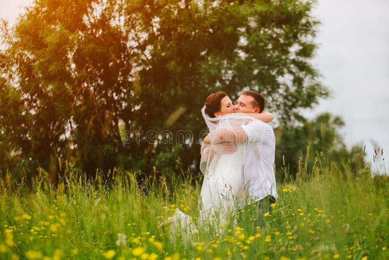 Expressive Couple Sincerely Hugging Themself on the Sunset Meadow Stock ...