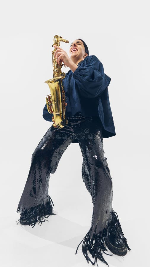 Expressive Female Saxophonist in Sequined Pants Bending into Dynamic ...