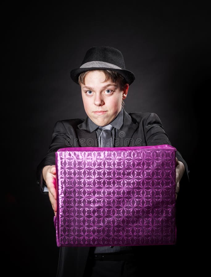 Expressive Teenage Boy Holding Box with Gift Stock Photo - Image of ...