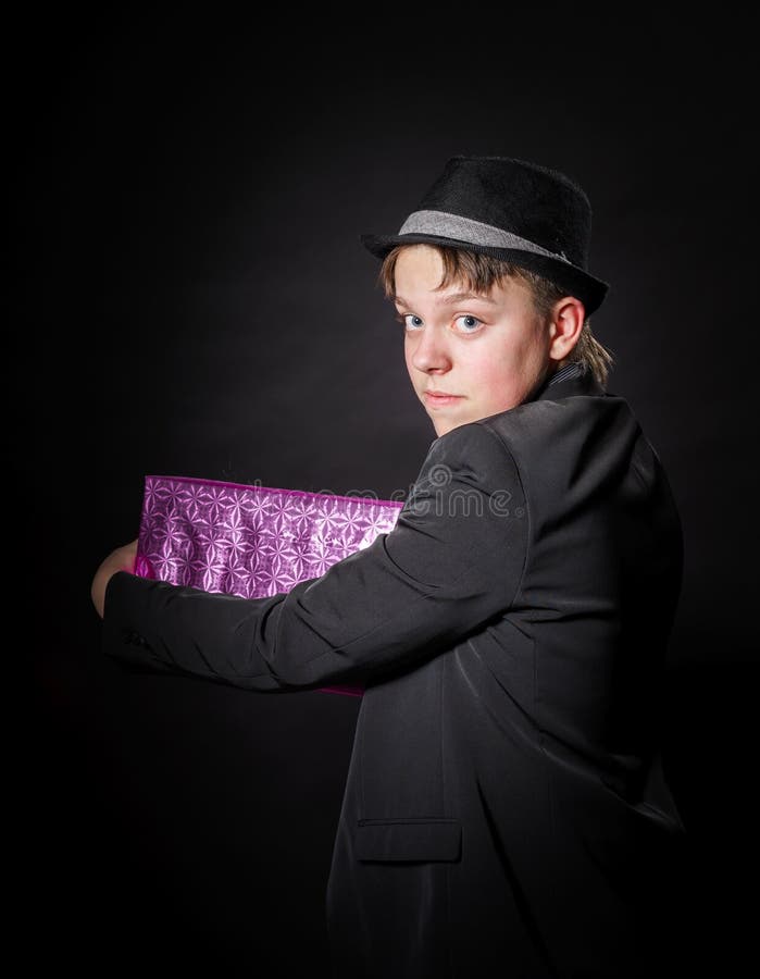 Expressive Teenage Boy Holding Box with Gift Stock Image - Image of ...