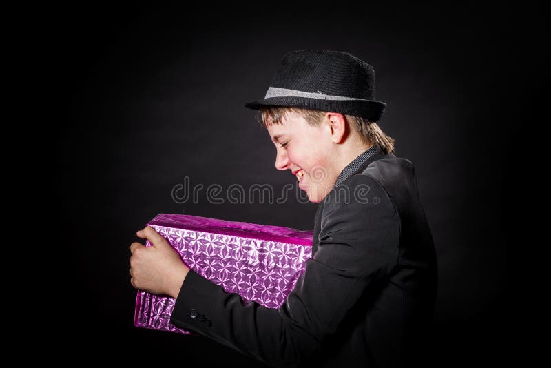 Expressive Teenage Boy Holding Box with Gift Stock Image - Image of ...