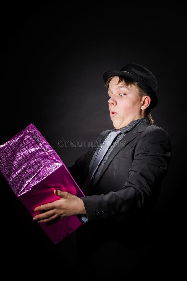 Expressive Teenage Boy Holding Box with Gift Stock Image - Image of ...