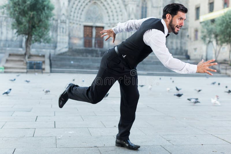 Expressive Man Running Past Old City Stock Photo - Image of movements ...