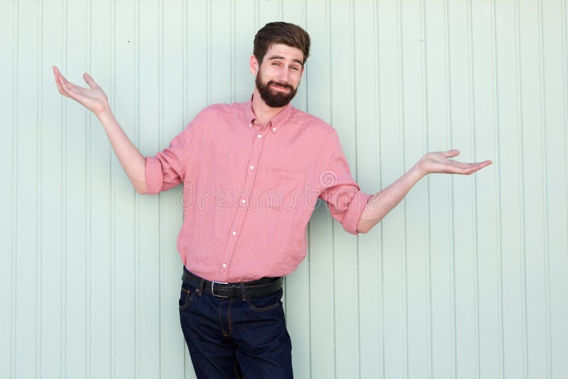 Expressive Young Man Standing with Arms Out To His Side Stock Image ...