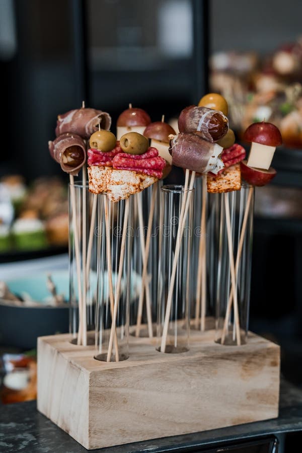 Exquisite Array of Gourmet Skewered Appetizers on Elegant Wooden Stand ...