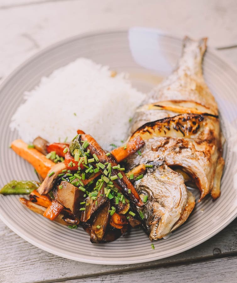 Exquisite Dish of Baked Sea Bream with White Rice Stock Image - Image ...