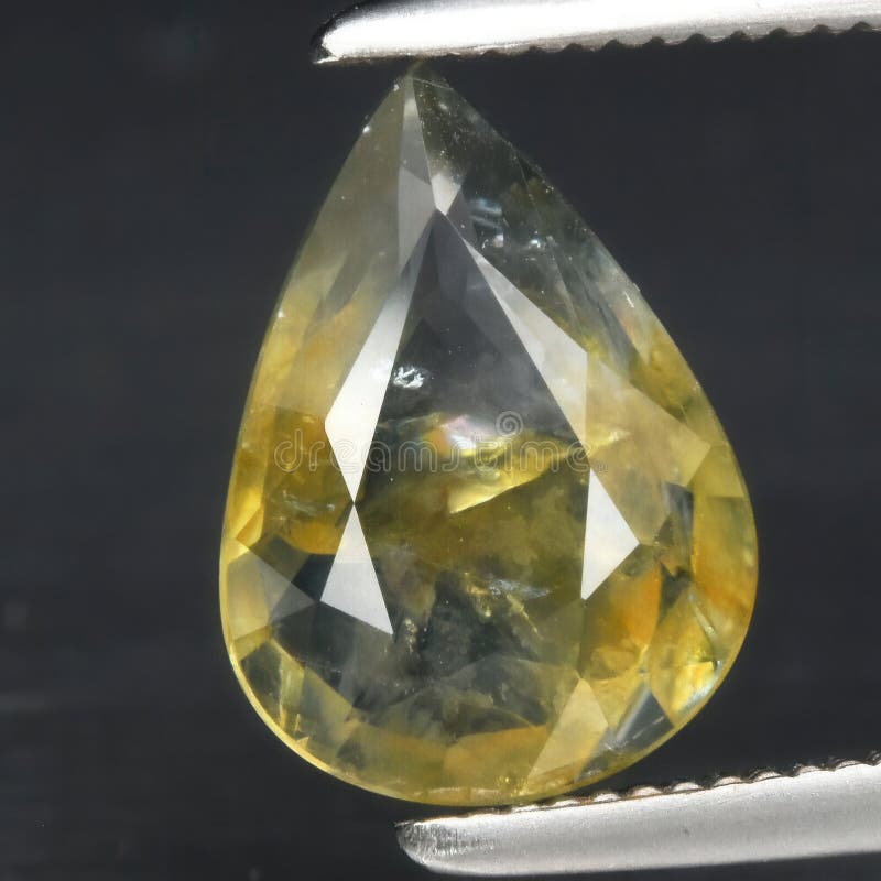 Exquisite Pear-Shaped Yellow Diamond Captured in Brilliant Detail Stock ...