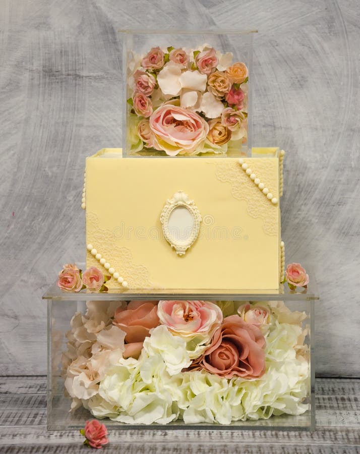 Exquisite Three Tiered Chocolate Wedding Cake on Glass Box Decorated ...