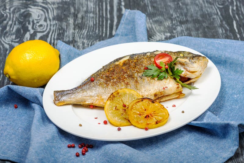 Exquisite White Grilled Fish with Lemon in Restaurant Stock Image ...