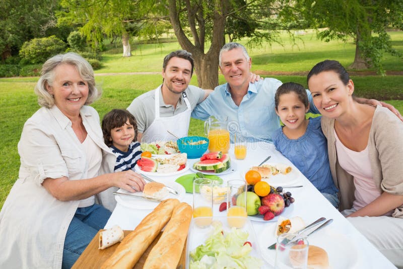Extended Family Dining at Outdoor Table Stock Image - Image of male ...