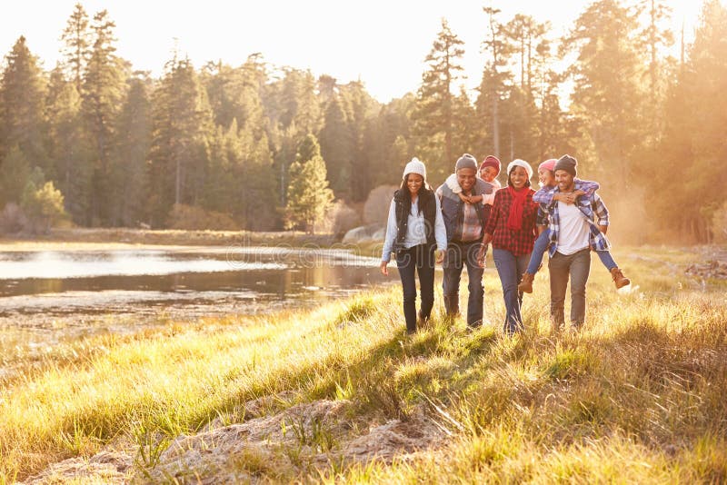 Extended Family Group Walking by Lake Stock Photo - Image of hike ...
