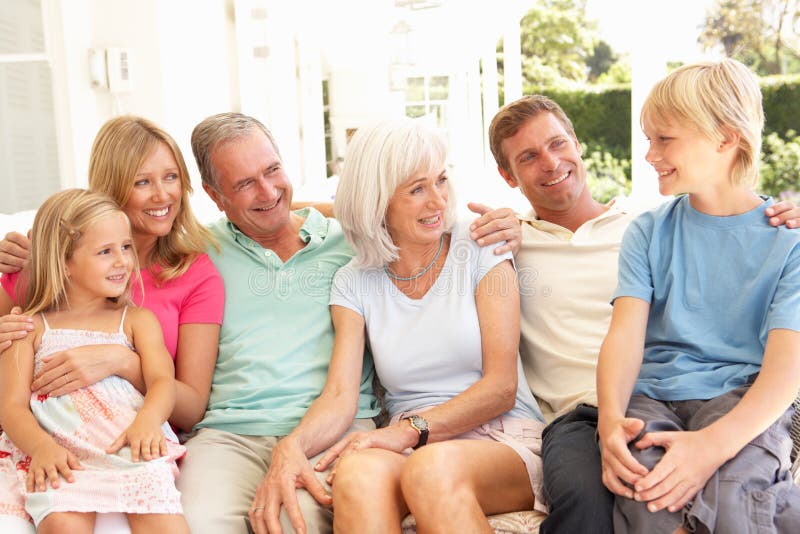 Extended Family Relaxing Together on Sofa Stock Photo - Image of ...