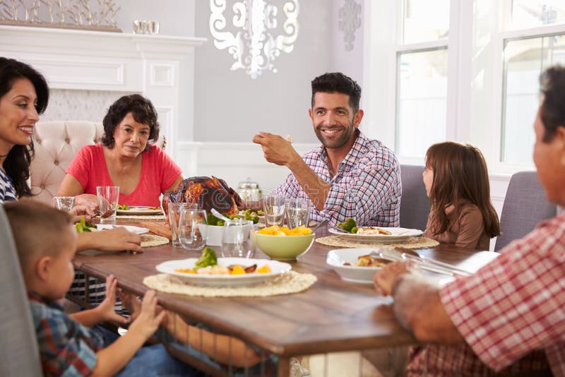 Extended Hispanic Family Enjoying Meal at Table Stock Image - Image of ...