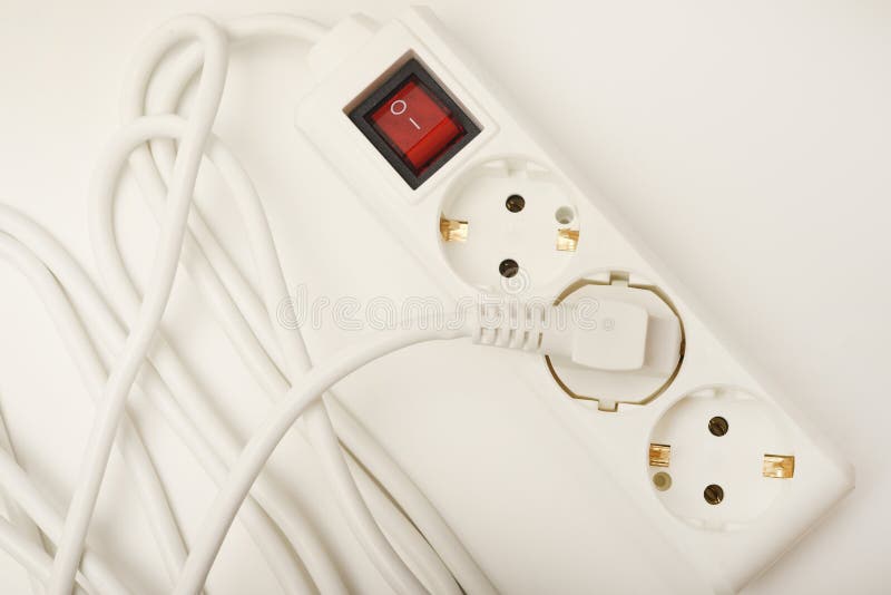 An Extension Cord with Three Sockets and a Red Switch Stock Photo ...