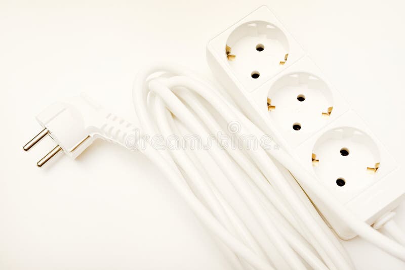 An Extension Cord with Three Sockets. White Wire with Sockets on a ...