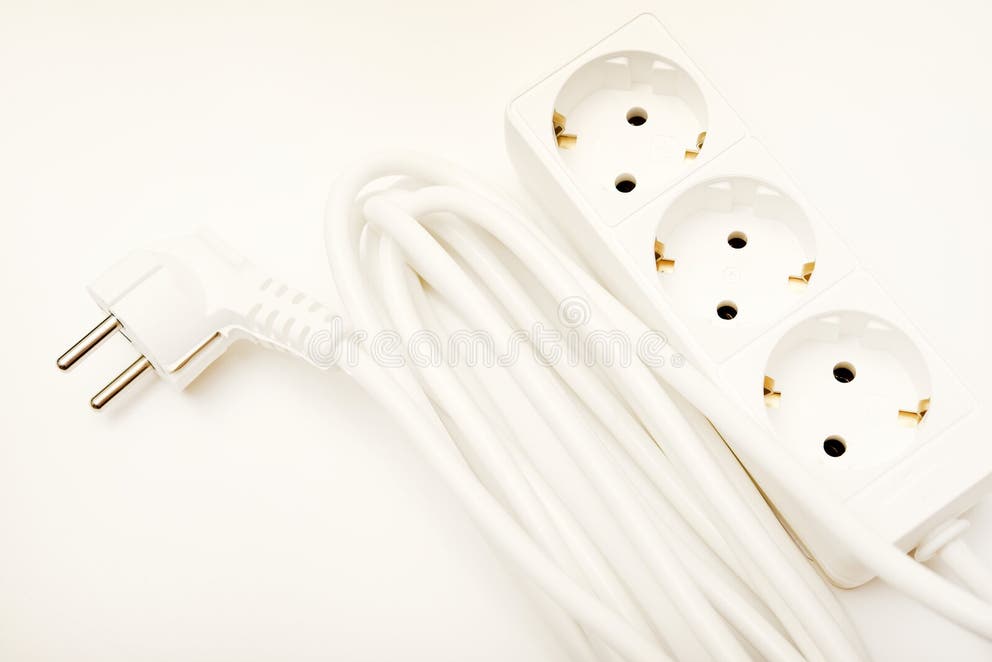 An Extension Cord with Three Sockets. White Wire with Sockets on a ...