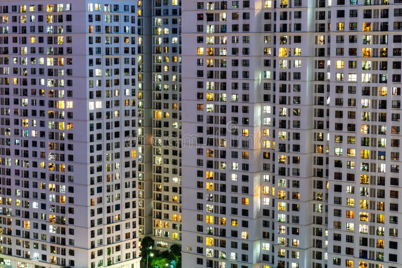 Exterior of Apartment Building at Night with Light from Windows Stock ...
