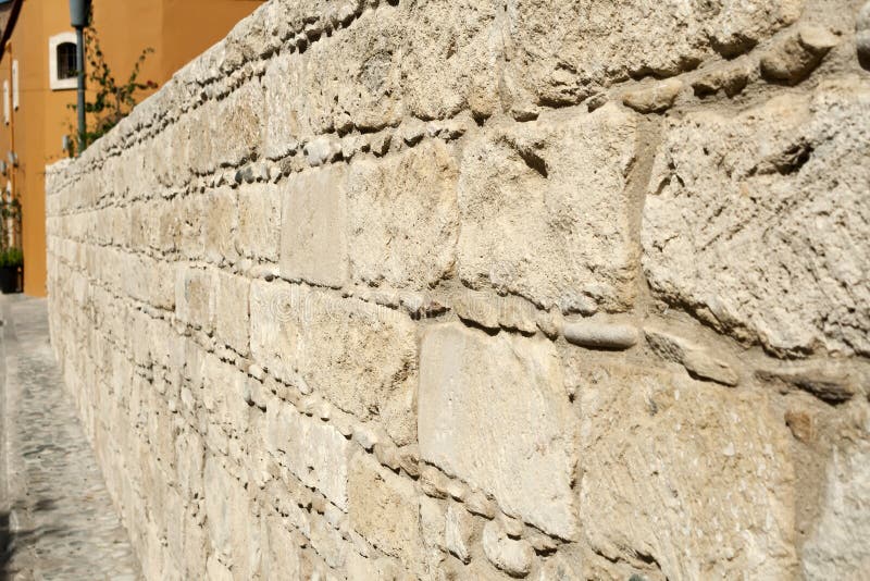 Natural Stone Wall in Sunlight Stock Image - Image of material, uneven ...