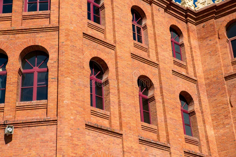 The Exterior Facade of a Brick Building with Large Windows Stock Photo ...