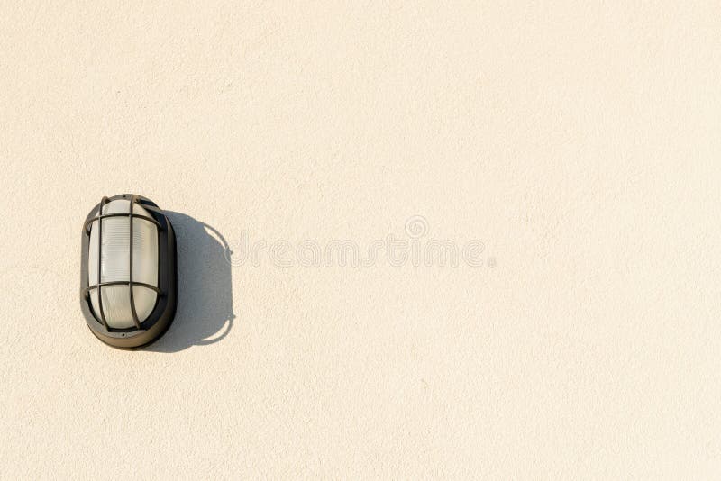 Exterior Light, Mounted on a Textured, Yellow Wall Stock Image - Image ...
