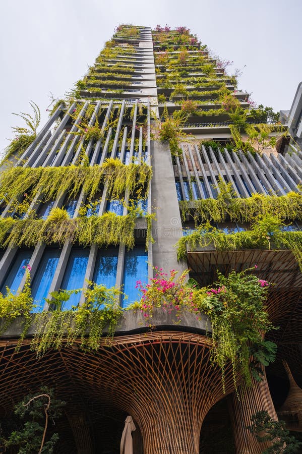 The Exterior of a Modern High-rise Building with Lush Vegetation ...